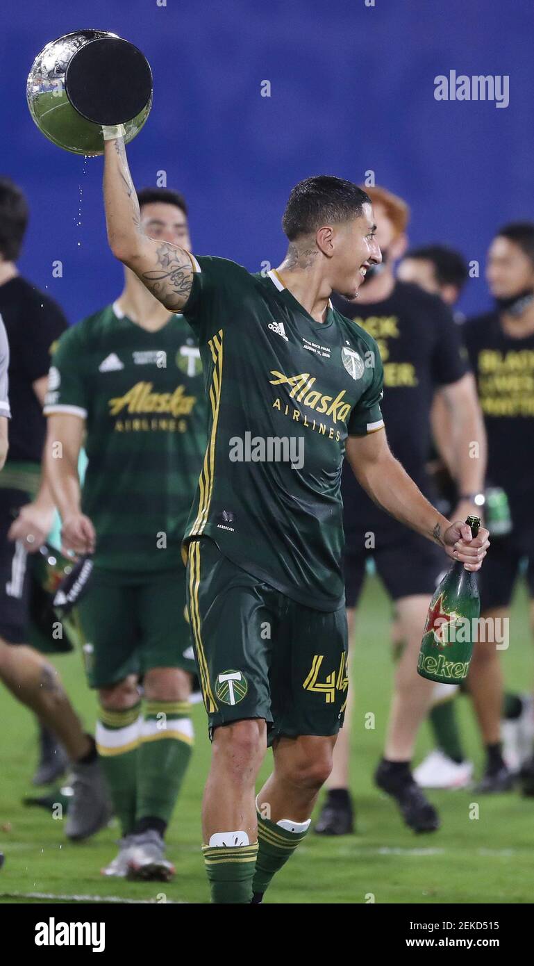 The Portland Timbers' Marvin Loria celebrates with the trophy after ...