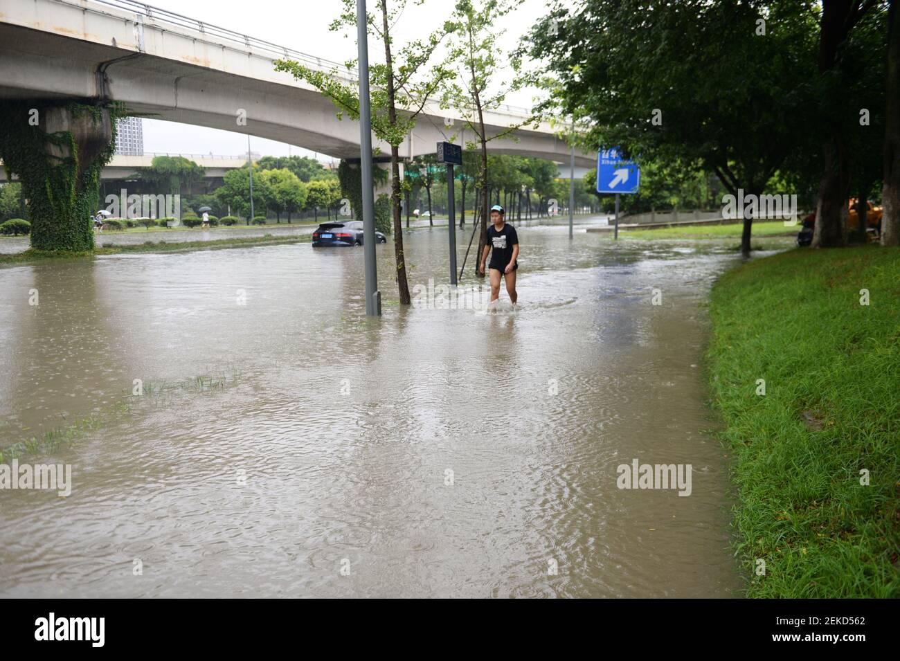 People travel through the city logging caused by heavy rainfall in ...