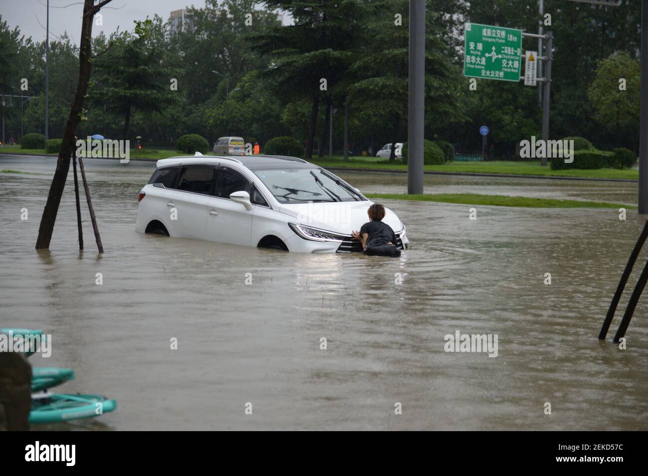 A car is submerged by the city logging caused by heavy rainfall in ...