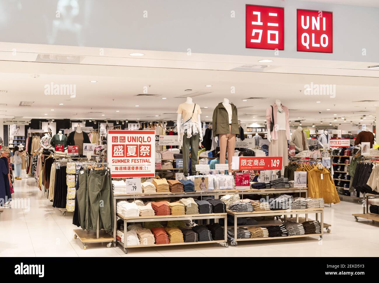 Japanese clothing brand Uniqlo logo and store in Hong Kong. (Photo by ...