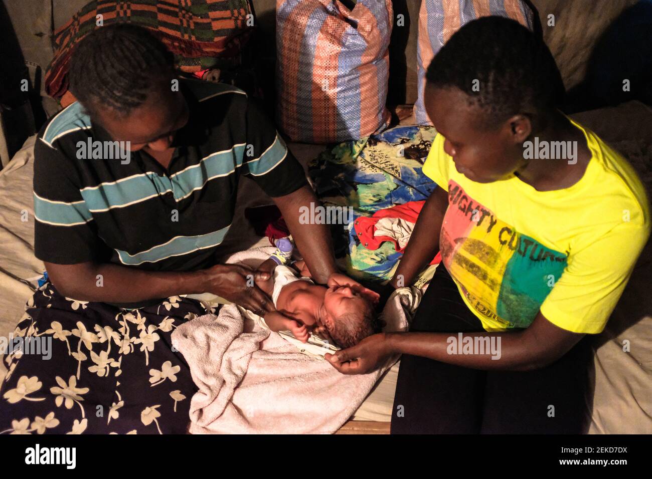 19 year old single mother Angelina Auma (R) and her mother Pamela ...