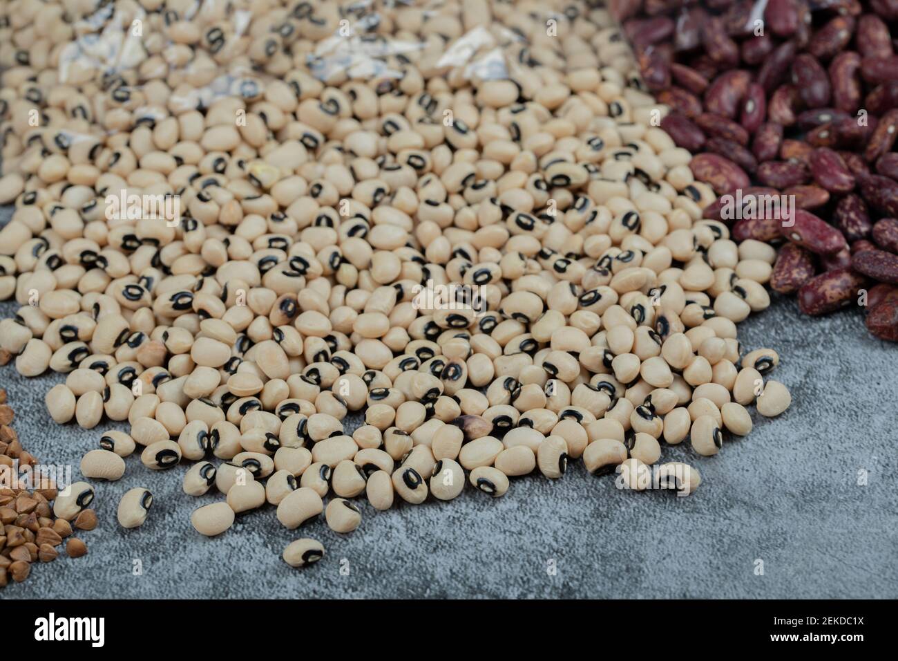Uncooked kidney beans on a grey background Stock Photo - Alamy