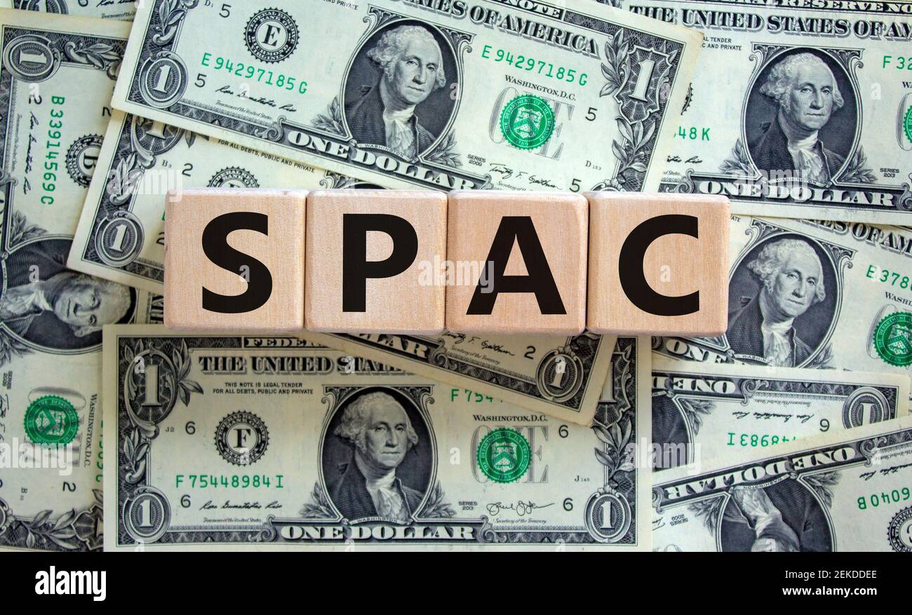 SPAC, special purpose acquisition company symbol. Wooden cubes with ...