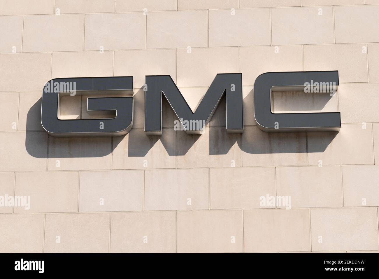 GMC company logo seen on one of their car dealerships showrooms. (Photo ...