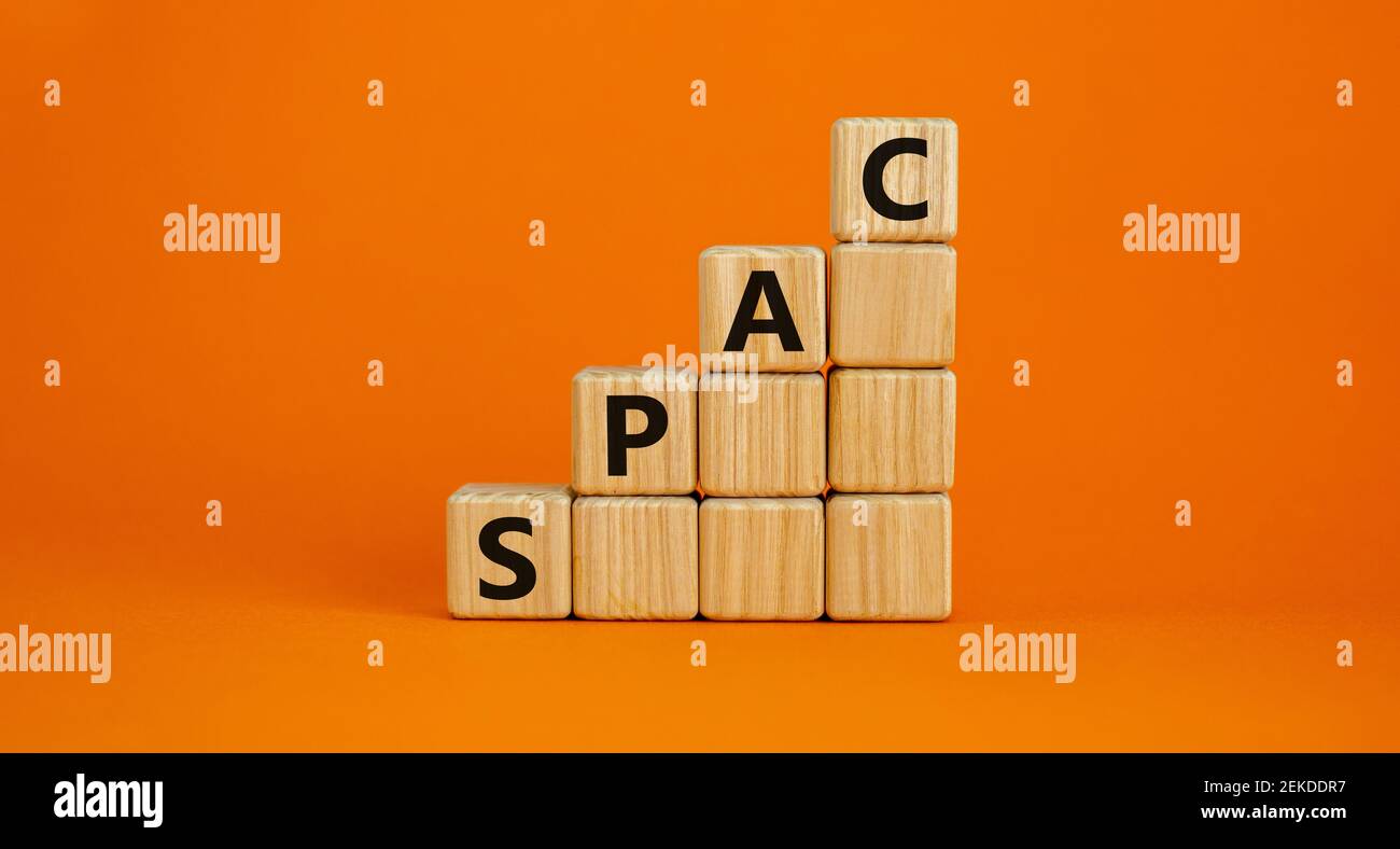 SPAC, special purpose acquisition company symbol. Businessman holds ...