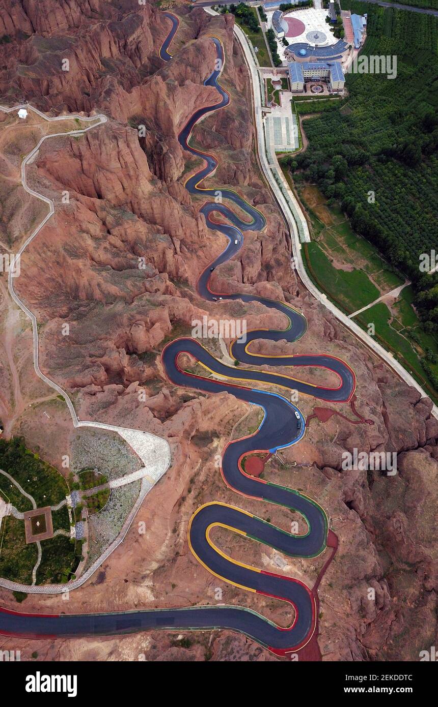 Aerial view of the cliff road with 22 turns at the Yellow River Hoodoo ...