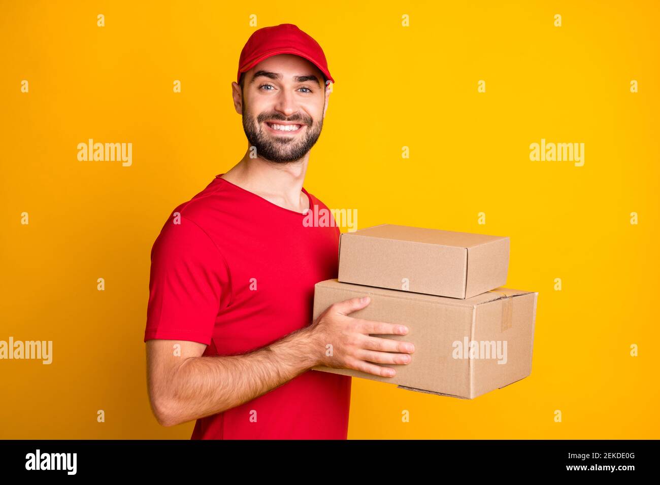 Profile side view portrait of nice content cheerful guy mailman holding ...
