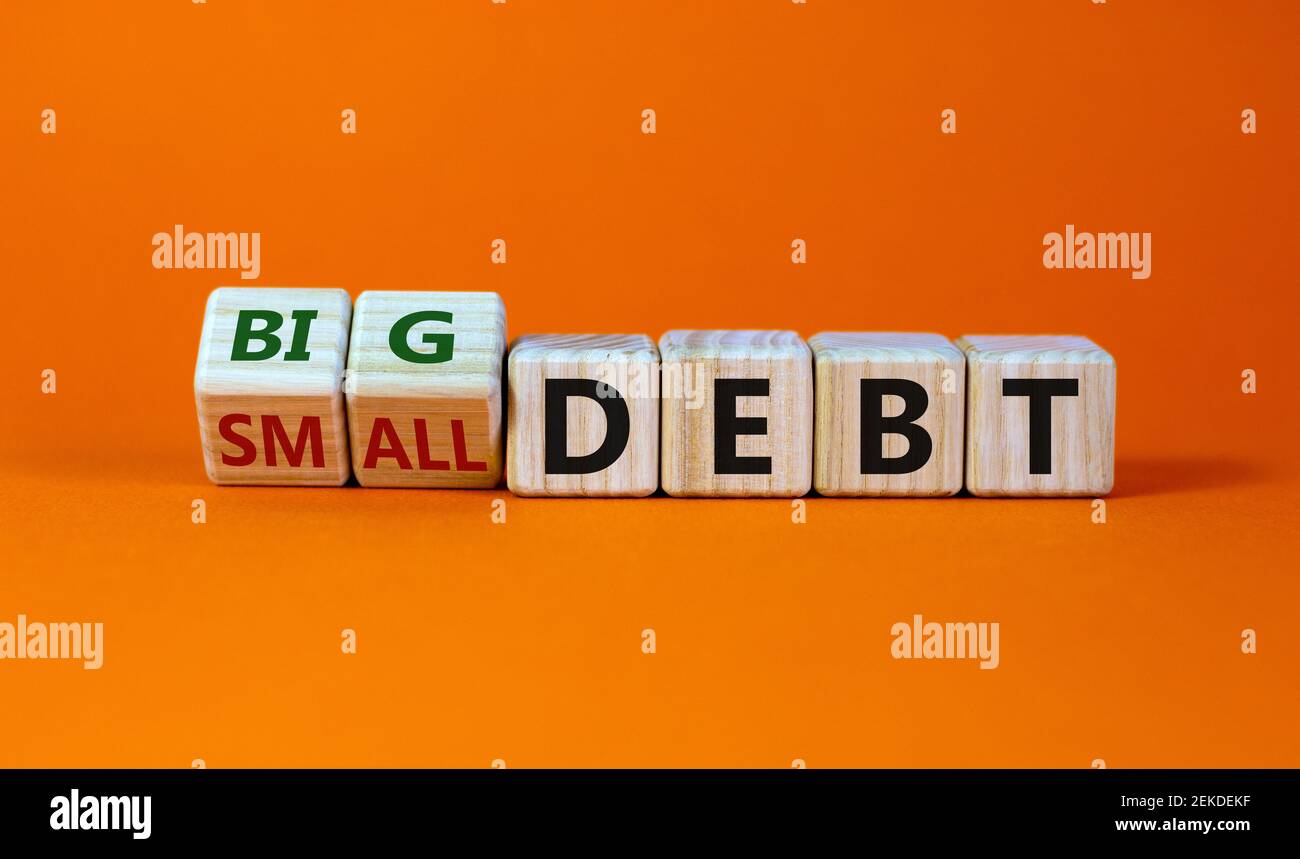 Big or small debt symbol. Turned wooden cubes and changed words 'small ...