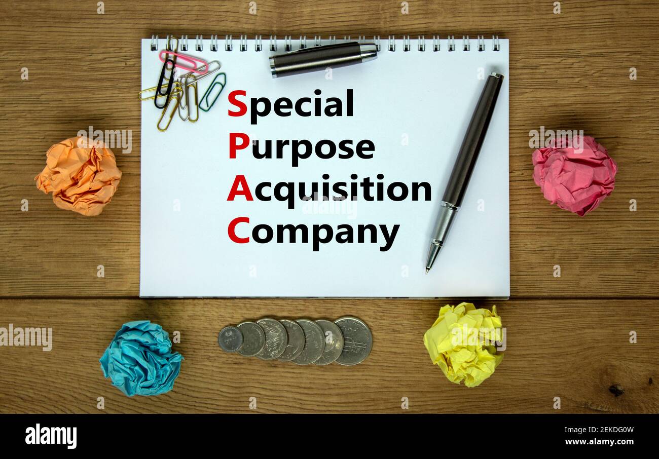 SPAC, special purpose acquisition company symbol. White note with words ...