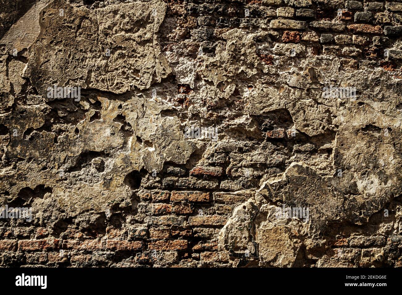Old brick and plaster wall texture background. Painted distressed wall ...