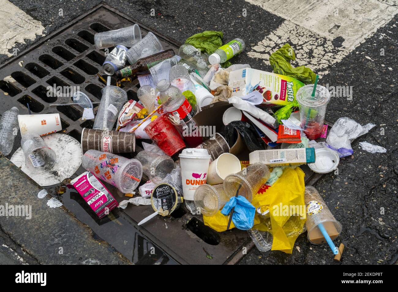 A clogged storm drain, filled with garbage, in the Chelsea neighborhood ...
