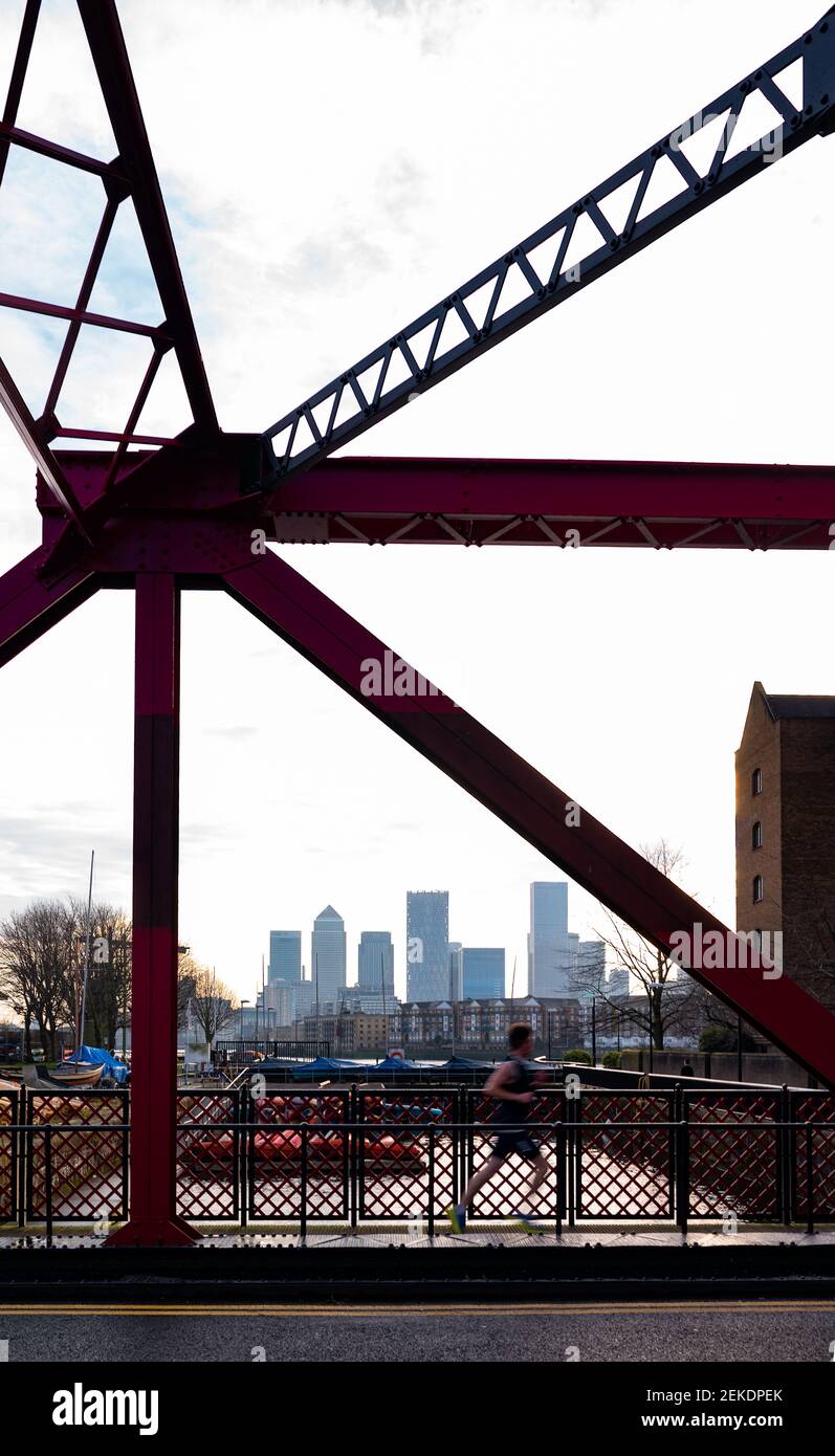 View through metal bridge to Canary Wharf Stock Photo - Alamy