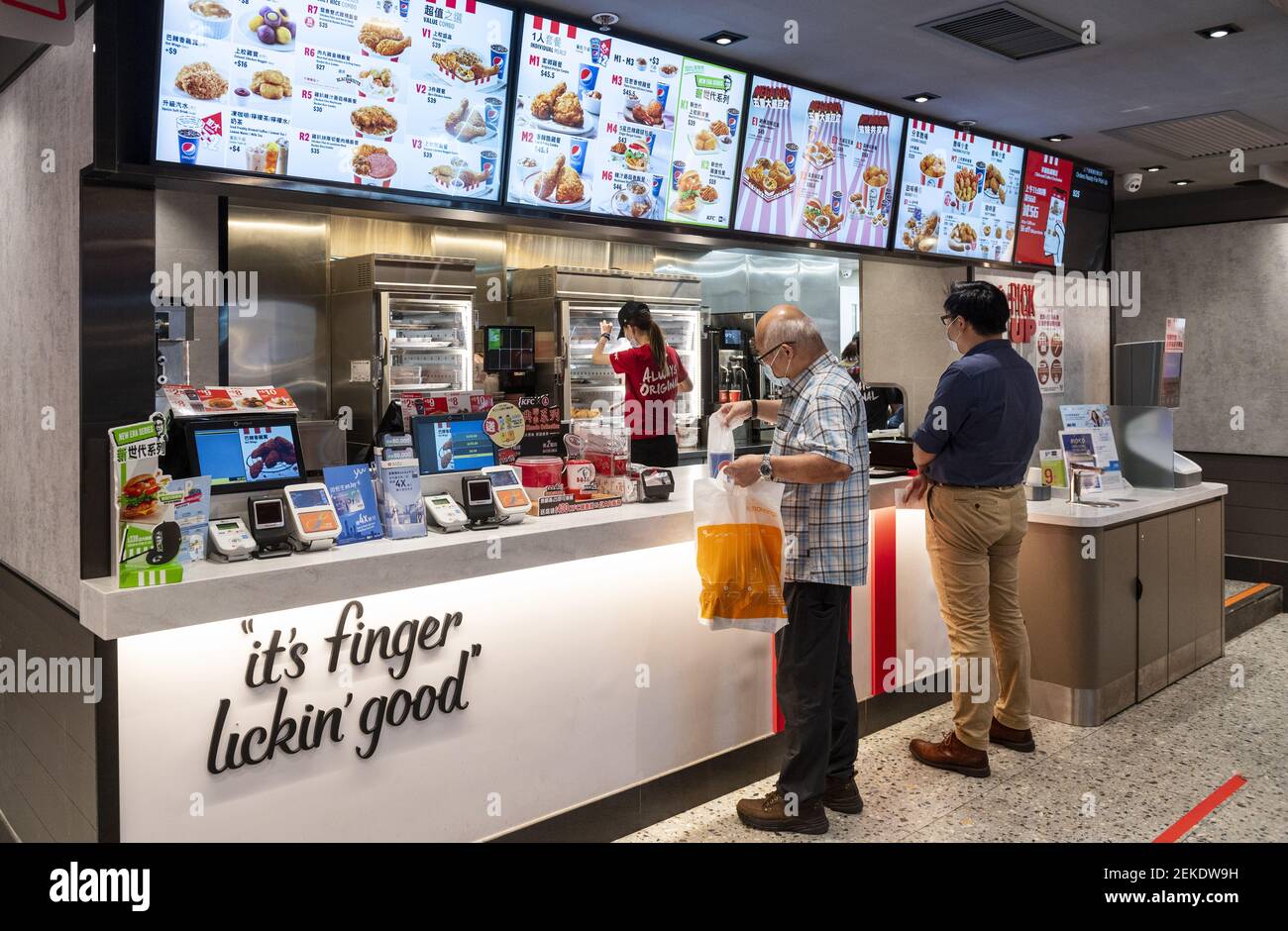 Customers order food at the American fast food chicken restaurant chain ...
