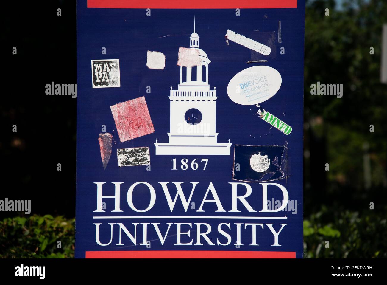 A general view of a Howard University sign dotted with faded stickers ...