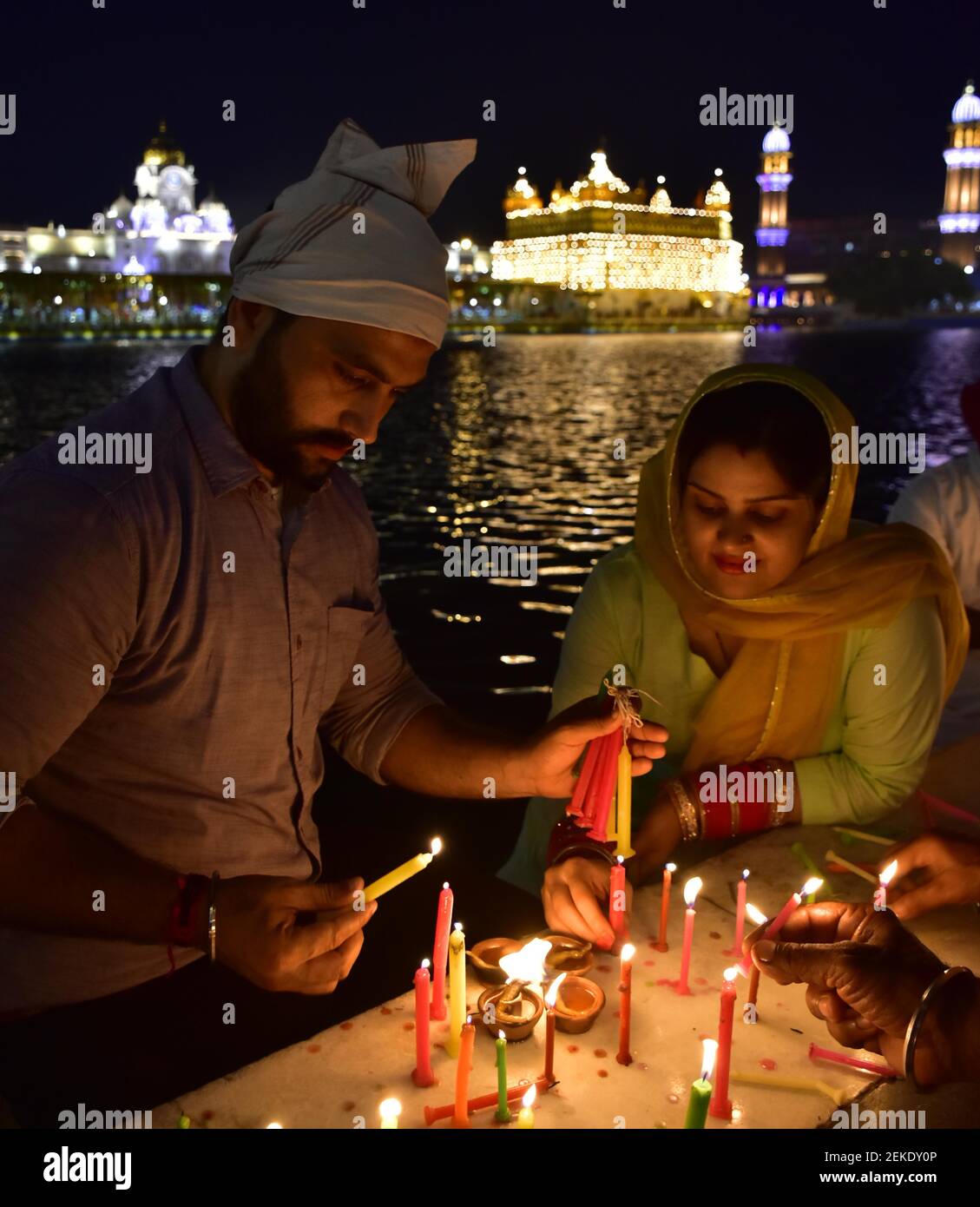 AMRITSAR, INDIA - AUGUST 19: Devotees light candles to mark the 416th ...