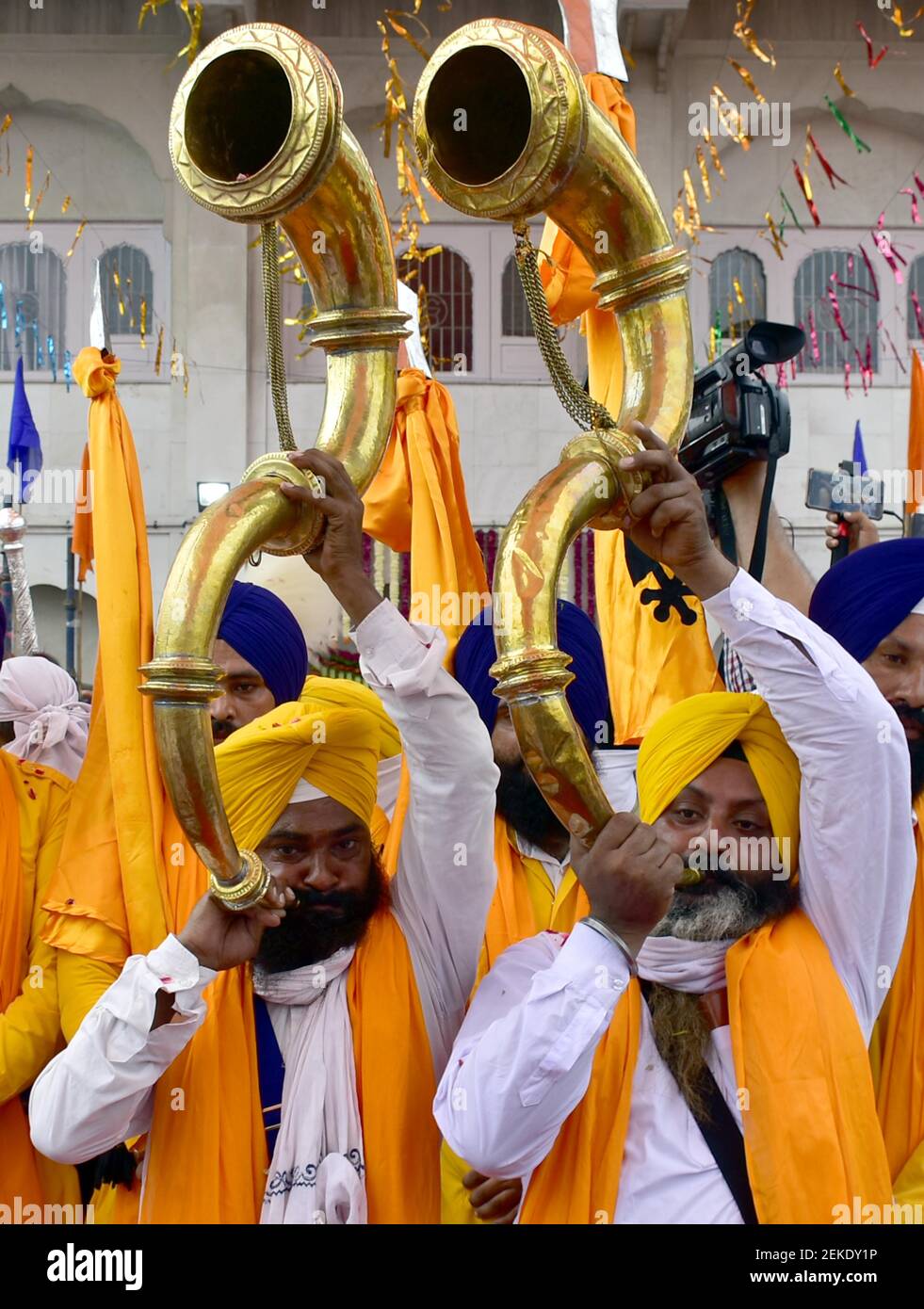 AMRITSAR, INDIA - AUGUST 19: Devotees blow trumpets during a Nagar ...