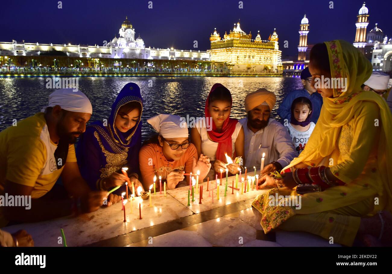 AMRITSAR, INDIA - AUGUST 19: Devotees light candles to mark the 416th ...