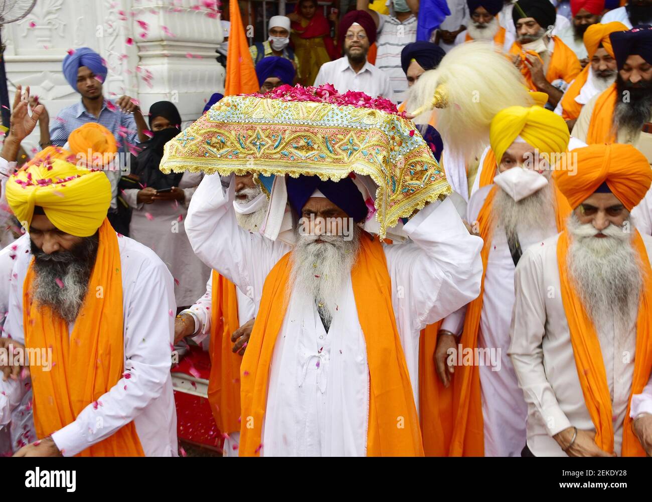 AMRITSAR, INDIA - AUGUST 19: Giani Jagtar Singh, head Granthi of Golden Temple carries the Sikh ...