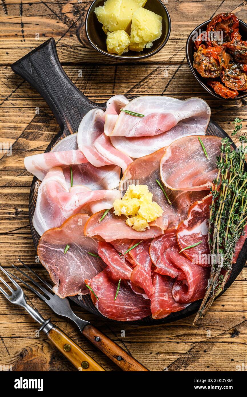 Italian Cold smoked and cured meat, cheese parmesan. wooden background ...
