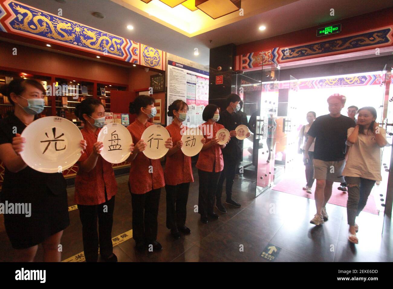 Staff at a local restaurant put up signs with characters saying "Clean ...