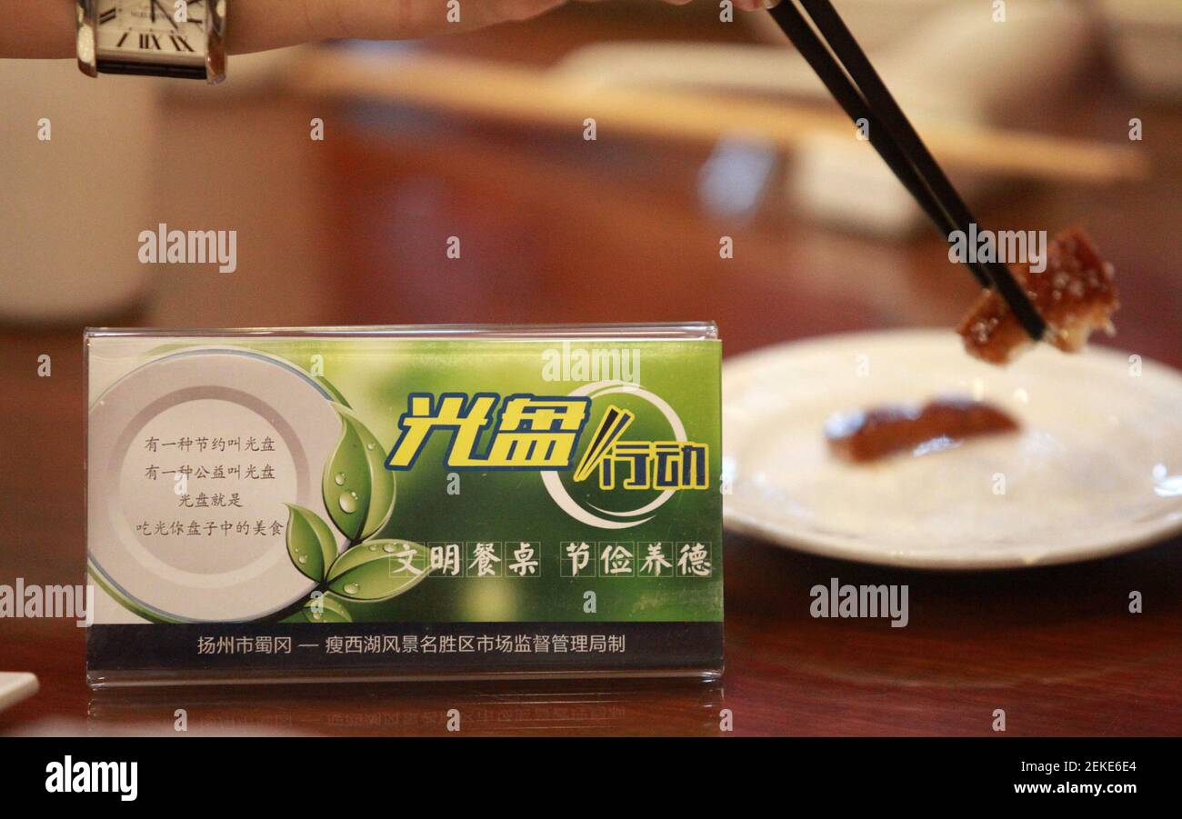 Staff at a local restaurant put up signs with characters saying "Clean ...