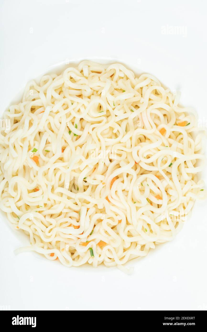 A white plate full of delicious noodles pasta Stock Photo - Alamy