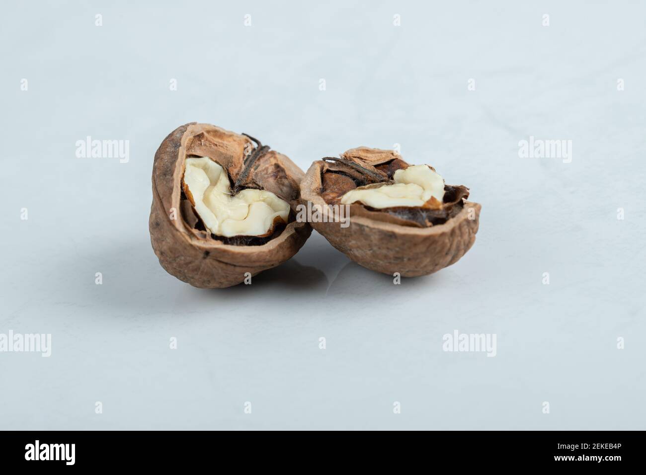 Cracked walnut isolated on the white background Stock Photo - Alamy