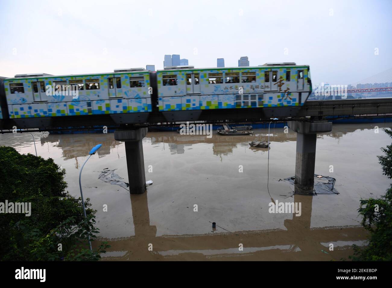 A metro train is seen taking passengers running above water, which was ...