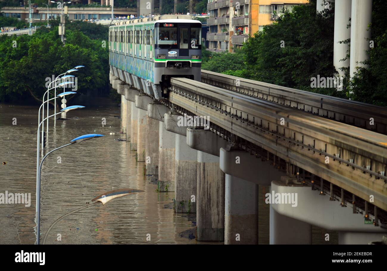 A metro train is seen taking passengers running above water, which was ...