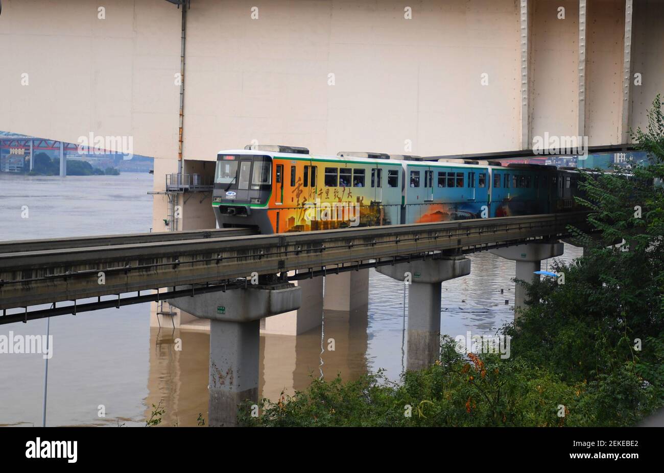 A metro train is seen taking passengers running above water, which was ...