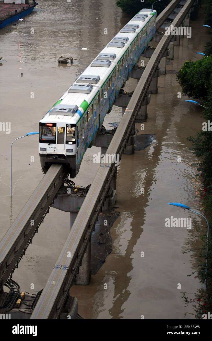 A metro train is seen taking passengers running above water, which was ...