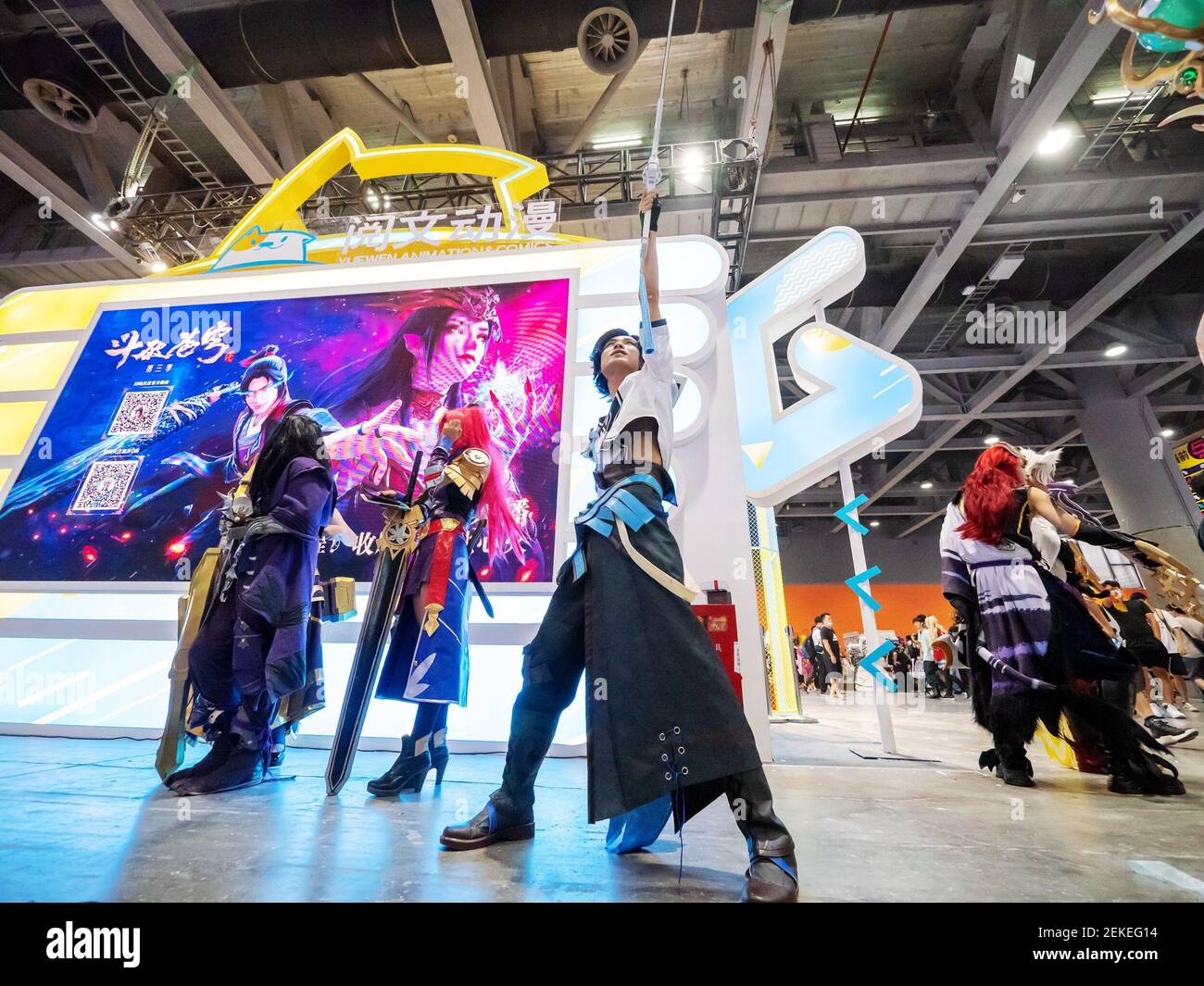 People dressed in anime costumes pose for pictures at the 24th Firefly ...
