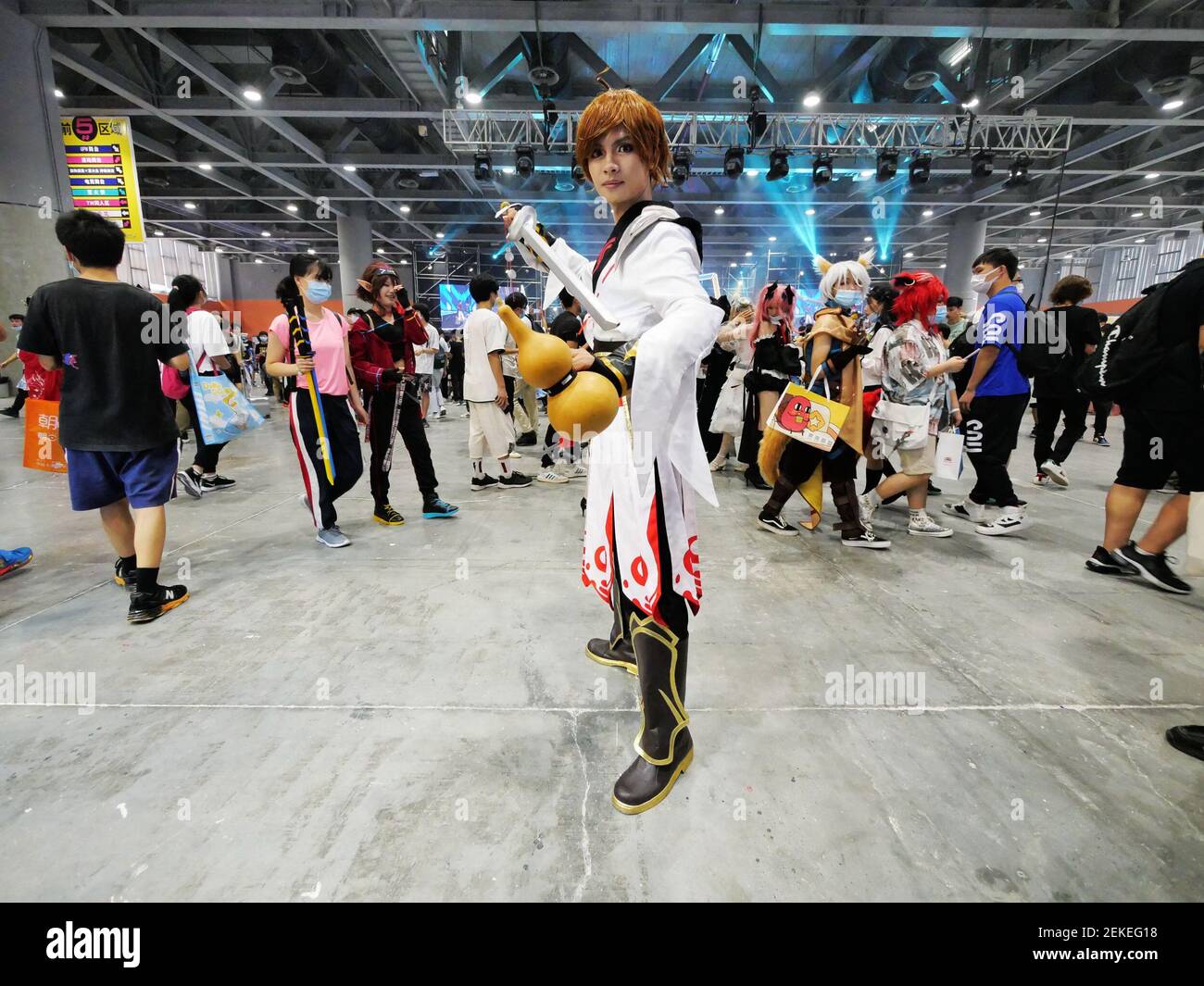People dressed in anime costumes pose for pictures at the 24th Firefly ...