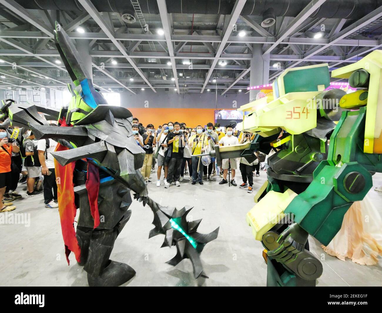 People dressed in anime costumes pose for pictures at the 24th Firefly ...