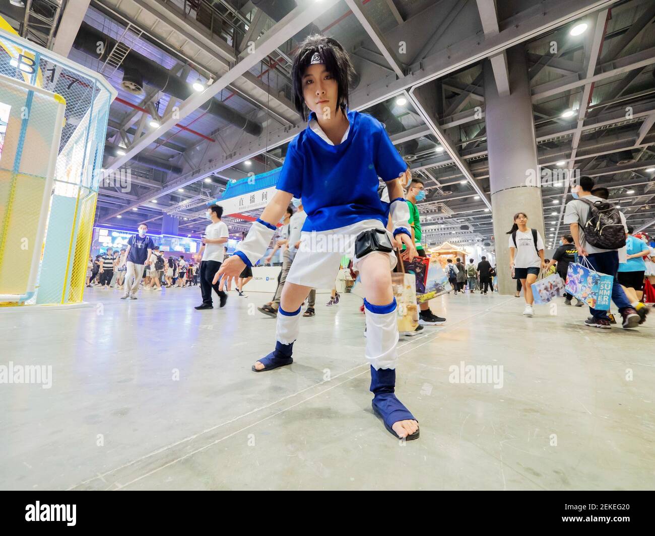 People dressed in anime costumes pose for pictures at the 24th Firefly ...