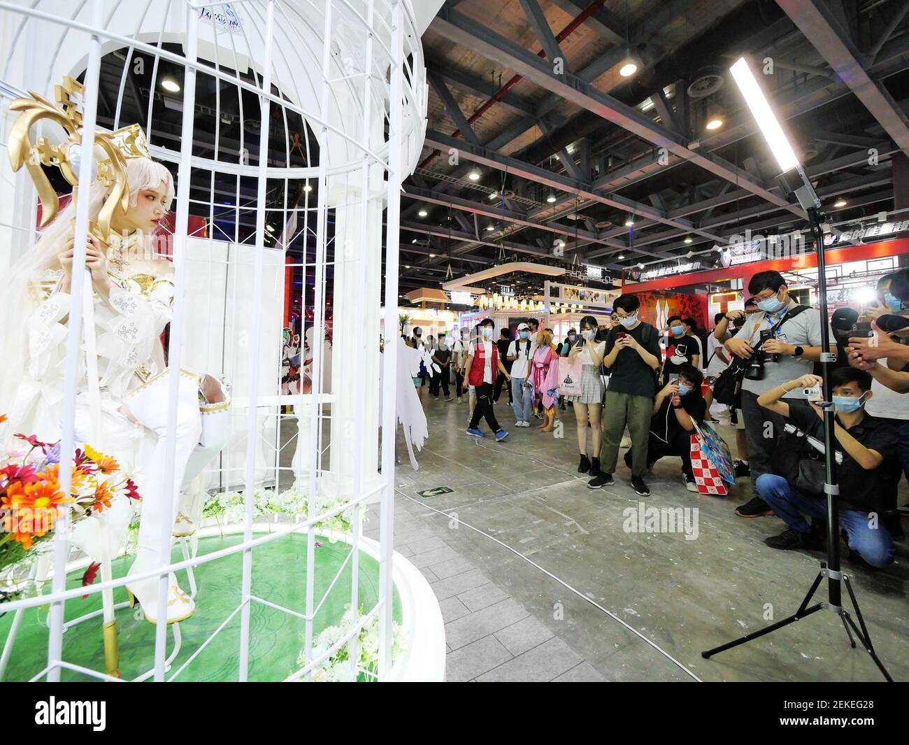 People dressed in anime costumes pose for pictures at the 24th Firefly ...