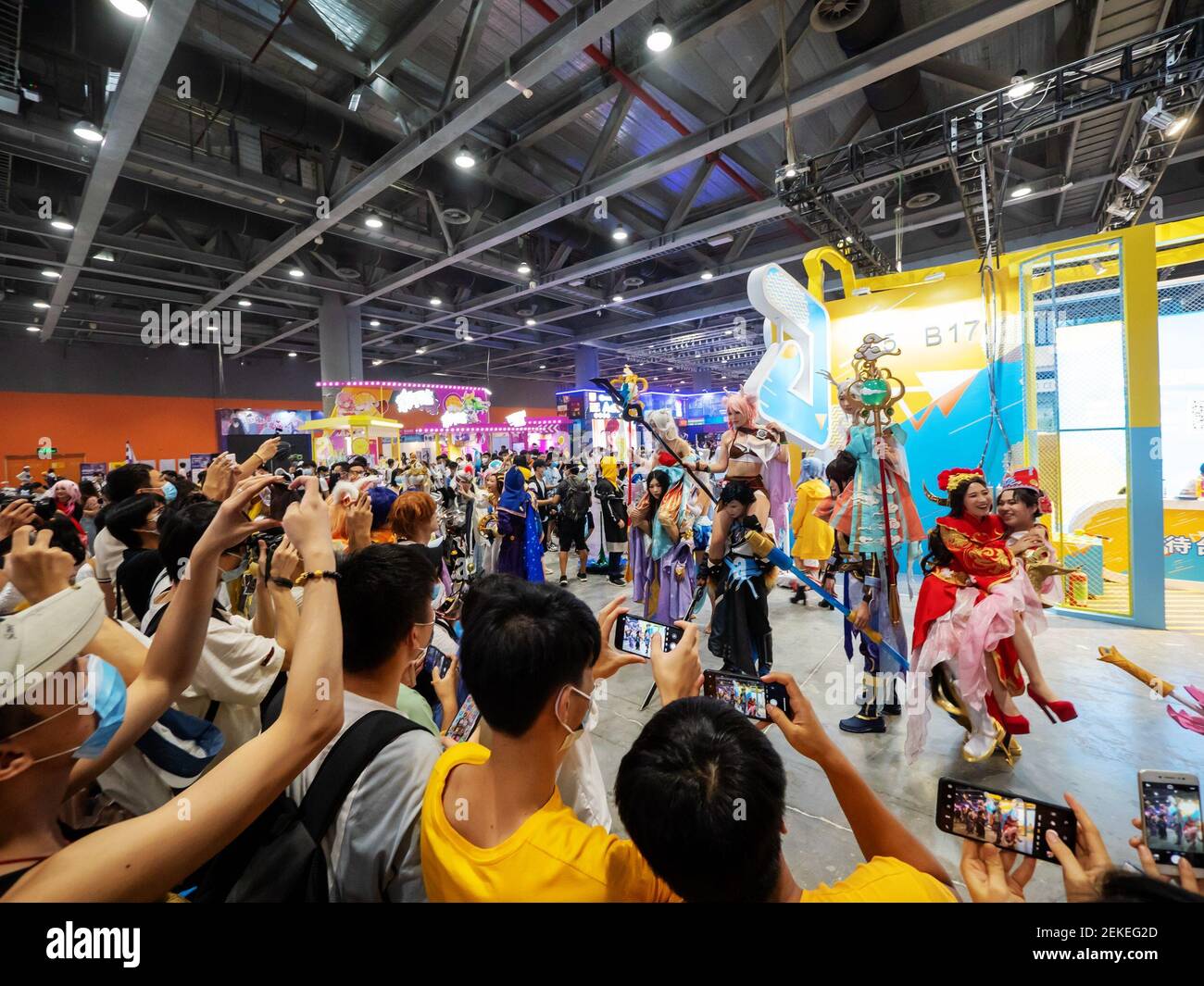 People dressed in anime costumes pose for pictures at the 24th Firefly ...