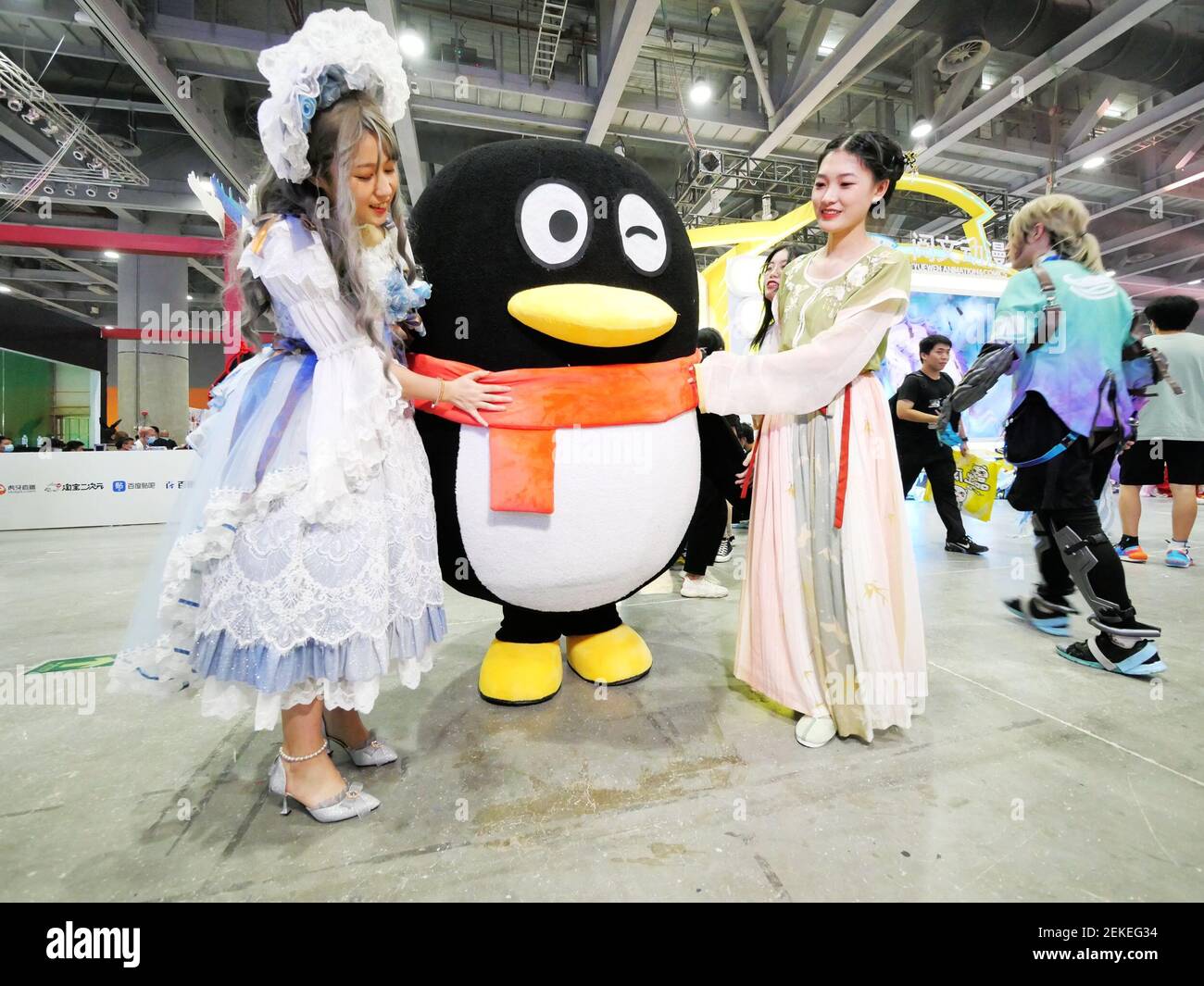 People dressed in anime costumes pose for pictures at the 24th Firefly ...