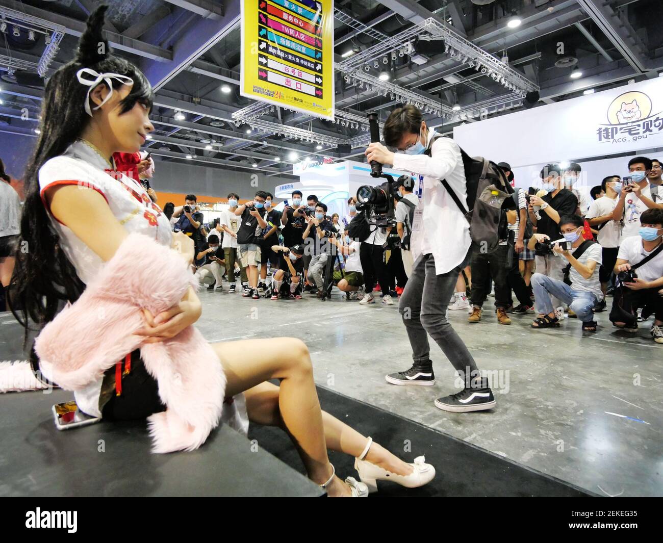 People dressed in anime costumes pose for pictures at the 24th Firefly ...