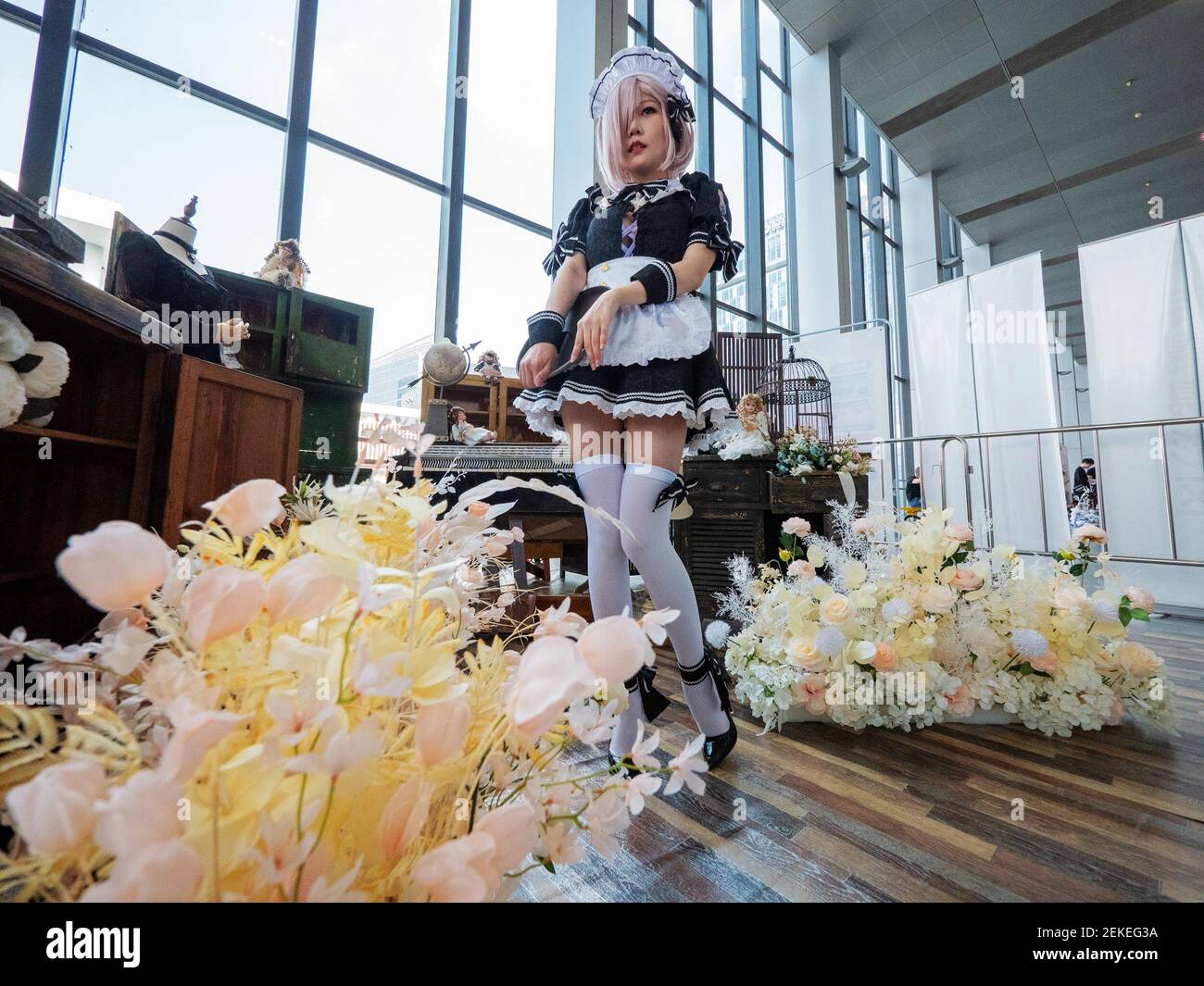 People dressed in anime costumes pose for pictures at the 24th Firefly ...