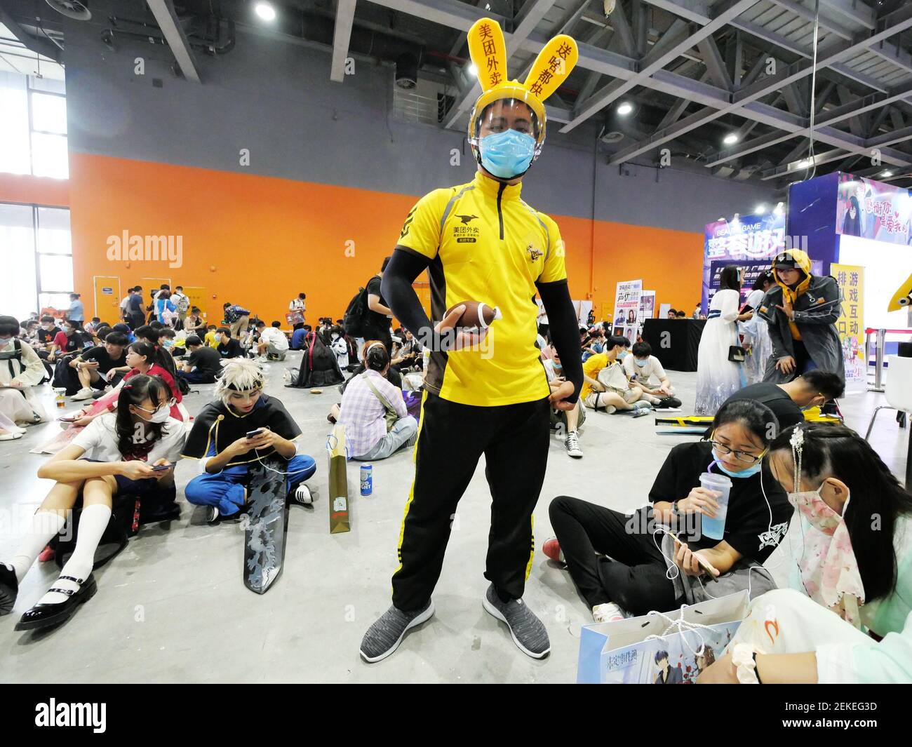 People dressed in anime costumes pose for pictures at the 24th Firefly ...