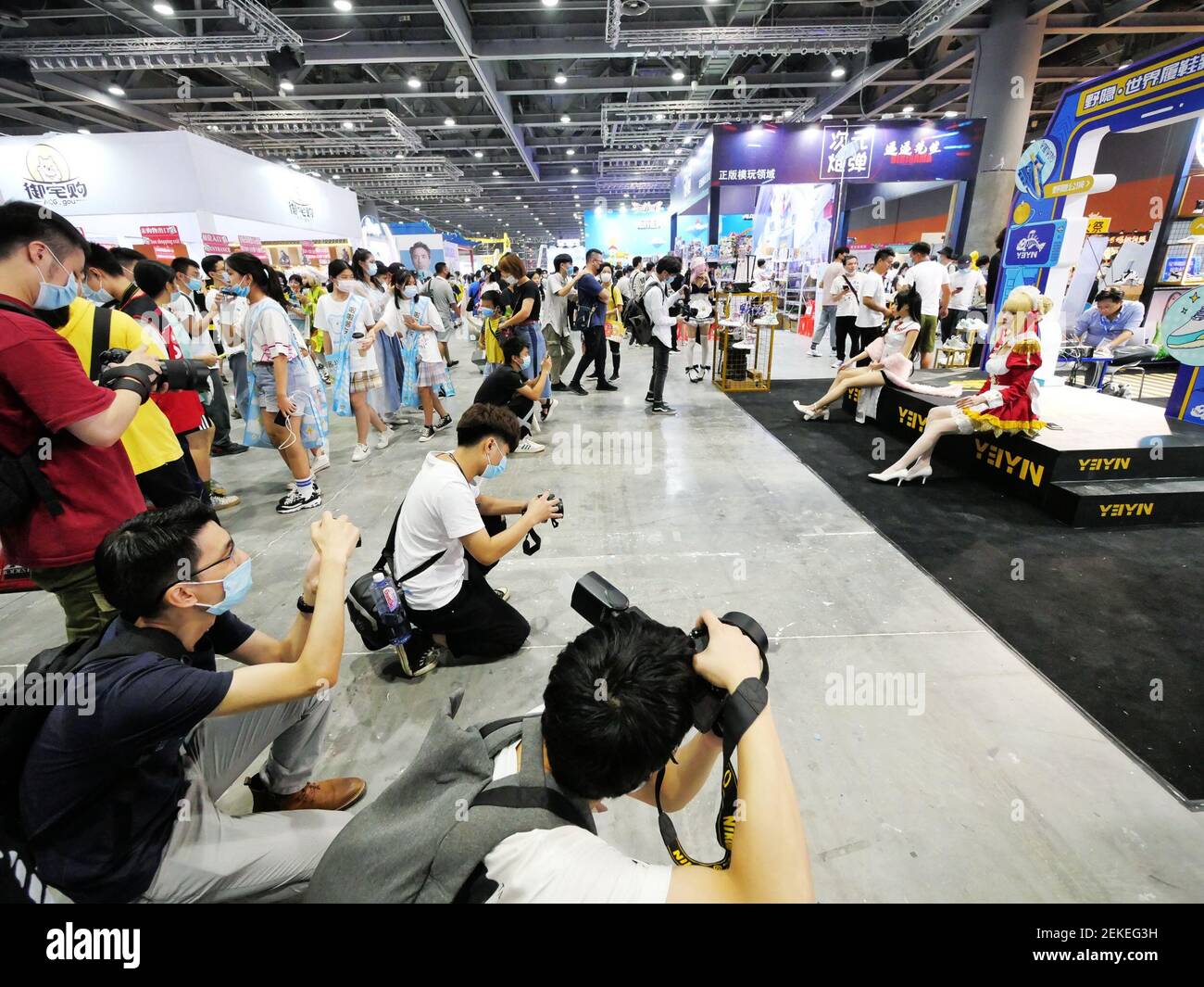 People dressed in anime costumes pose for pictures at the 24th Firefly ...