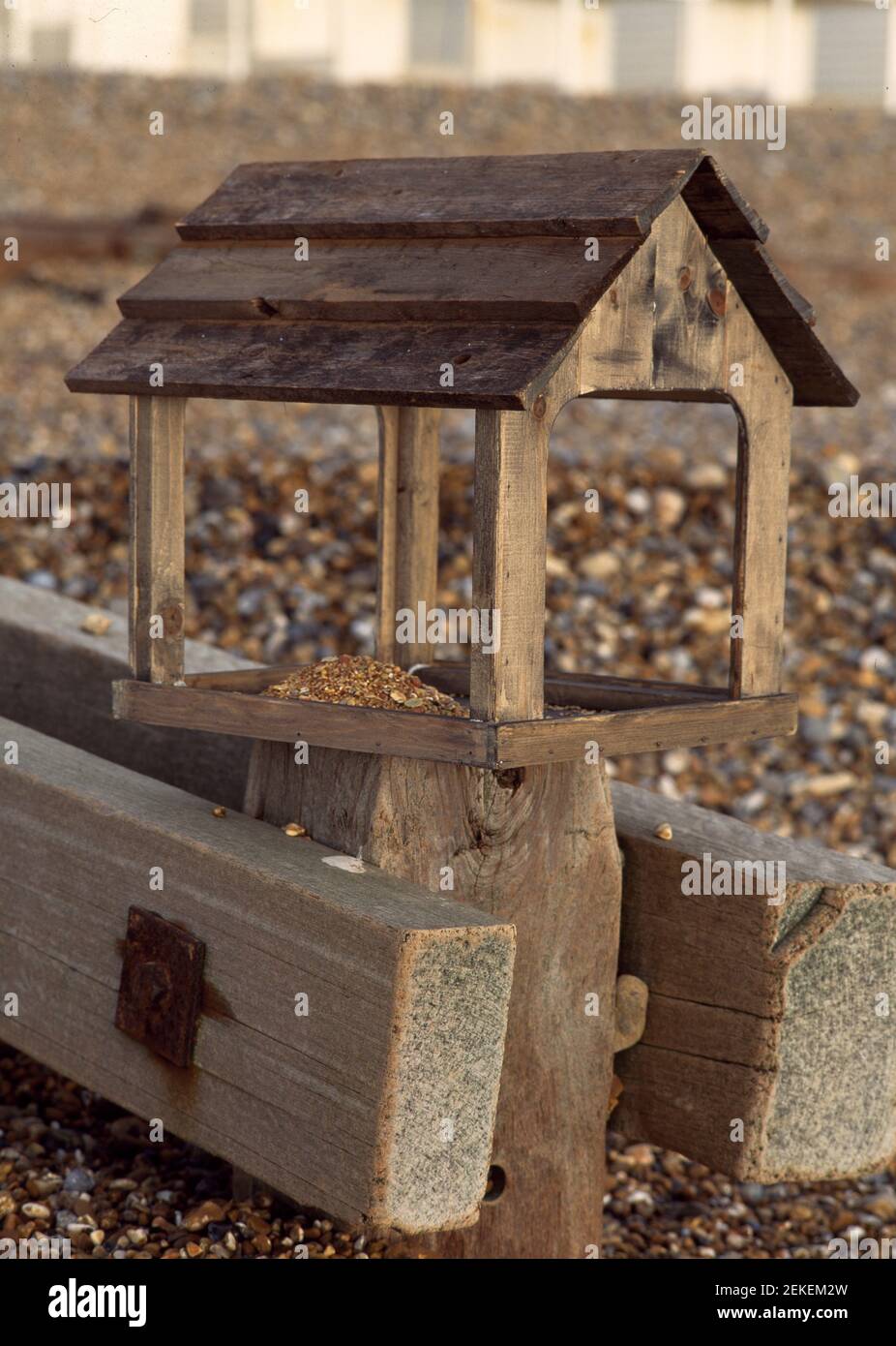 Wooden bird table designed with driftwood Stock Photo - Alamy