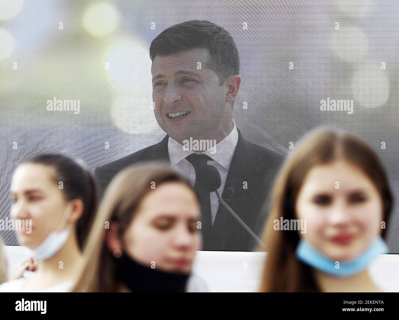 Ukrainian President, Volodymyr Zelensky seen on a screen as he speaks ...