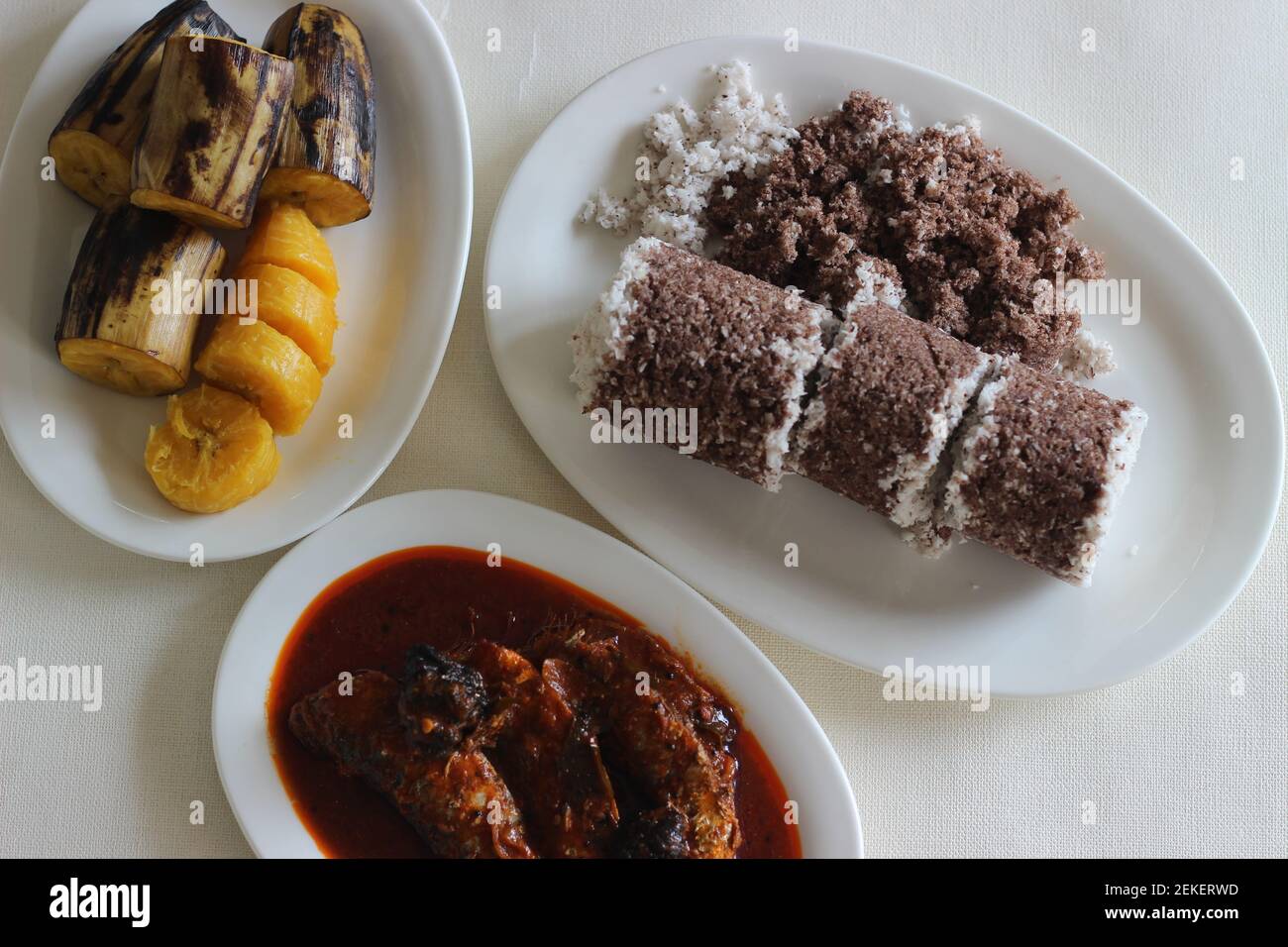 Steamed finger millet and coconut cake served with Sardines curry and ...