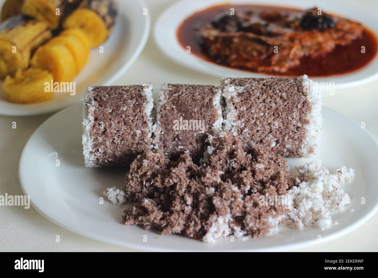 Steamed finger millet and coconut cake served with Sardines curry and ...