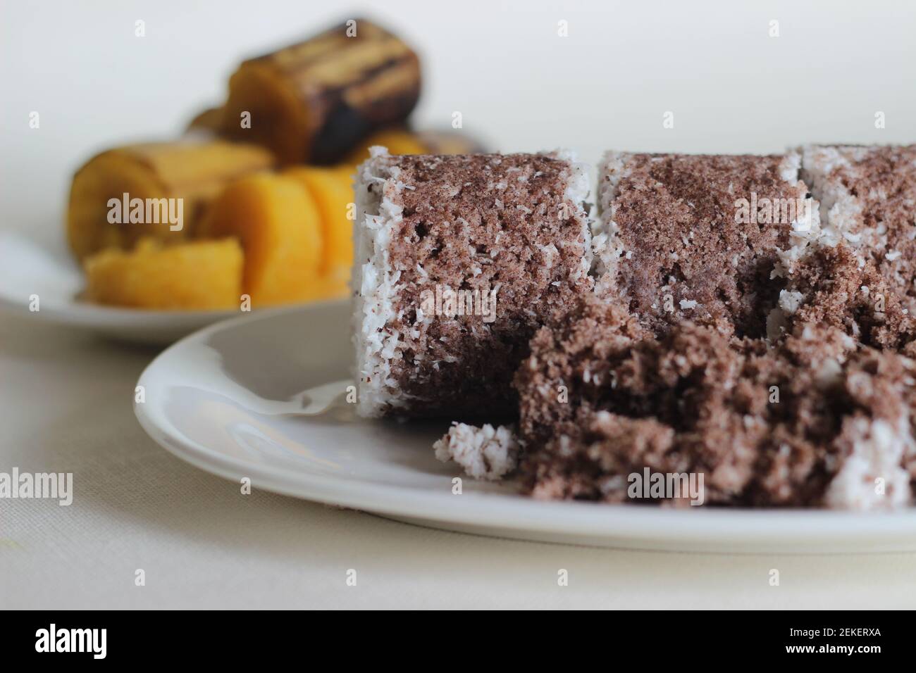Steamed finger millet and grated cocunut cake served with steamed ...
