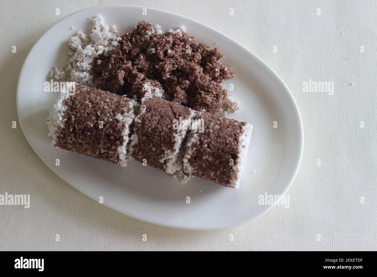 Steamed finger millet cake. Made with finger millet flour combined with ...
