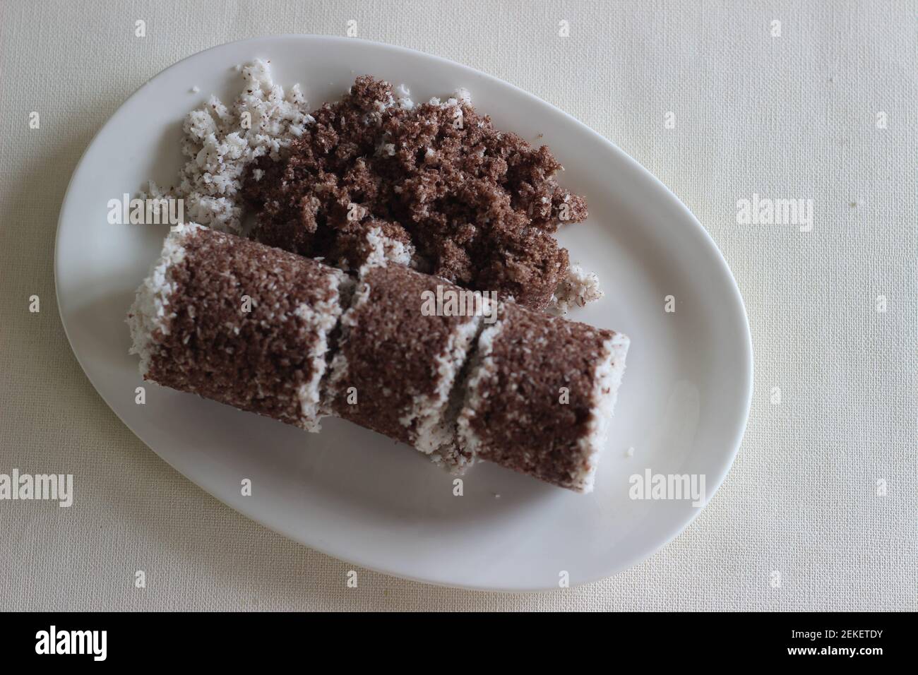 Steamed finger millet cake. Made with finger millet flour combined with ...