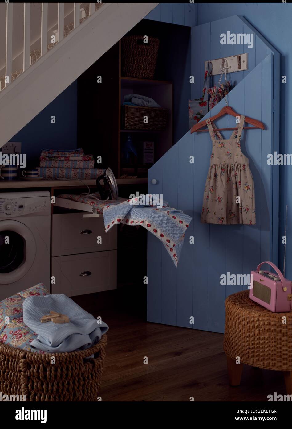 Washing machine in space under stairs with Roberts radio Stock Photo ...